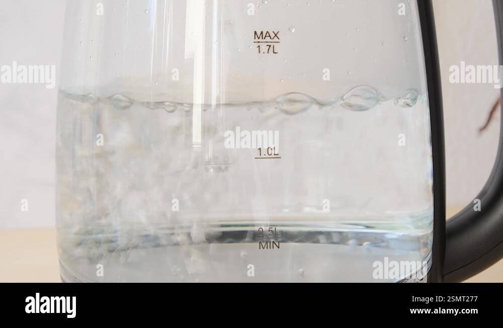 Close up view of boiling water boiling water in a transparent dish ...
