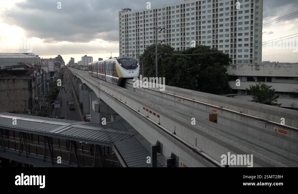 BTS yellow line skytrain above traffic in Bangkok Stock Video Footage ...