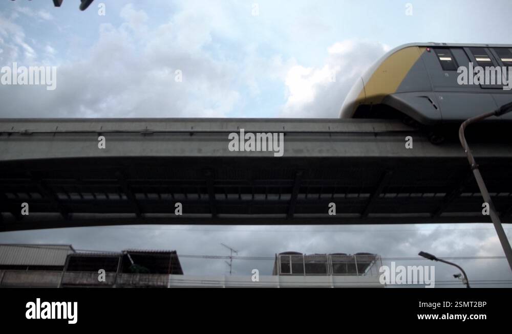 BTS yellow line skytrain above traffic in Bangkok Stock Video Footage ...