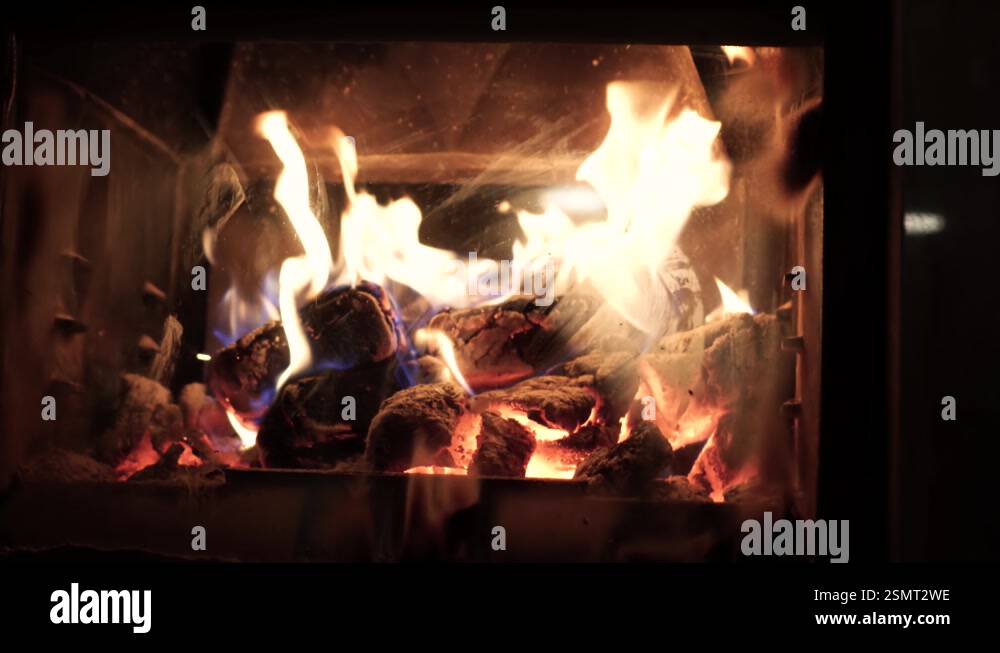 Burning fire logs inside stone fireplace. Close-up view Stock Video ...