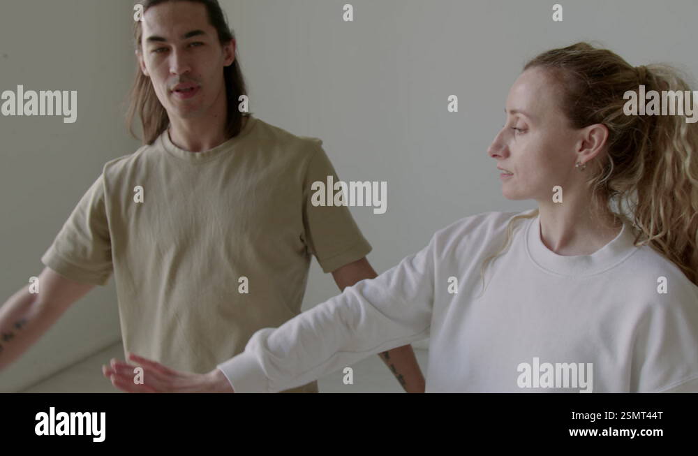 Ballerina Teaching Partner How to Perform Arm Movement in Dance Studio ...