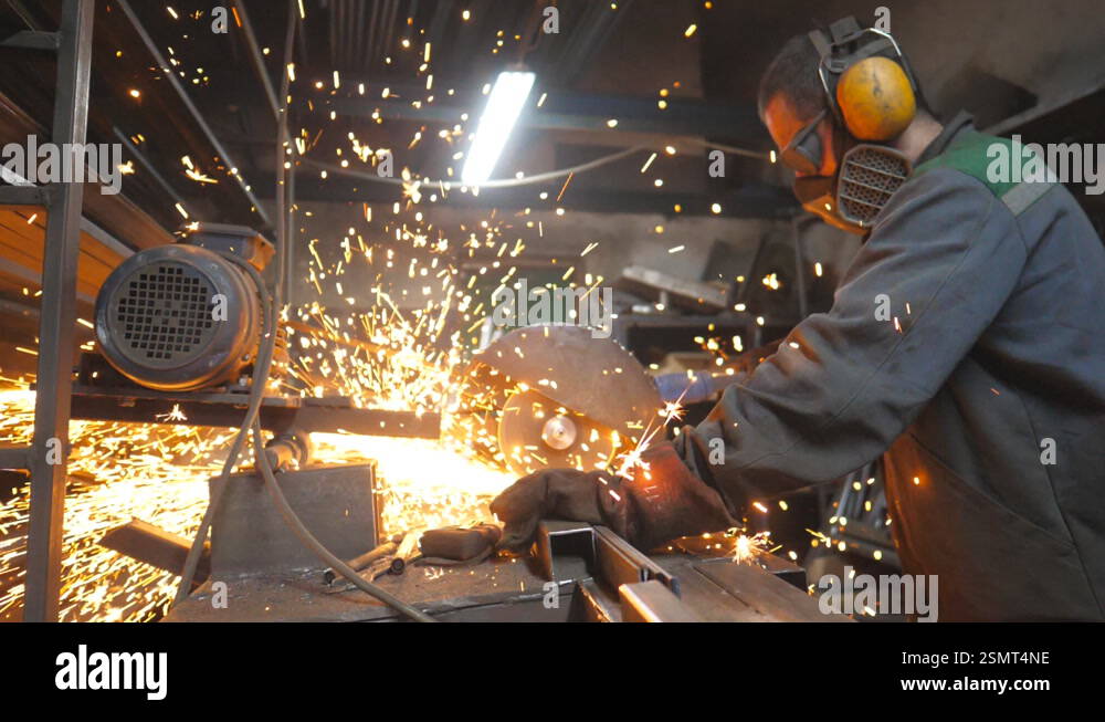Industrial professional worker use saw cutting machine to cut metal ...