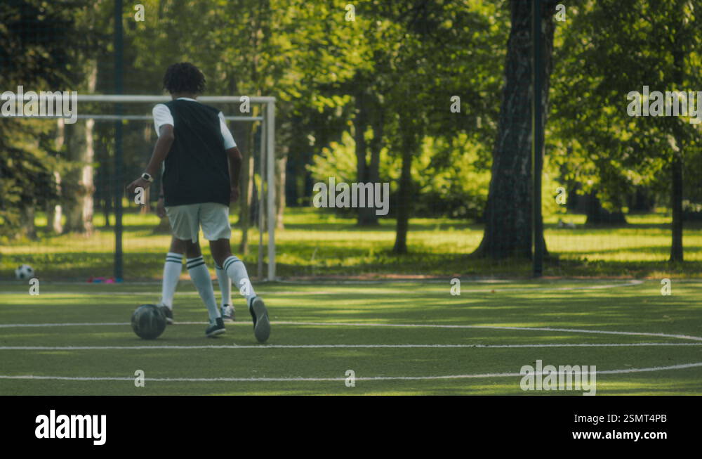 African American Gen Z Boys Playing Soccer in Park Stock Video Footage ...
