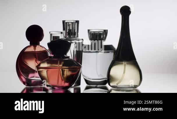 Elegant collection of various perfume bottles in different shapes and ...