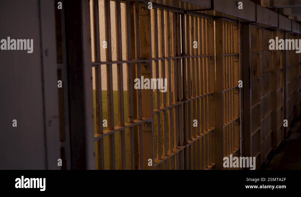 Slow motion landscape prison cell jail gaol crime bars block dorm ...