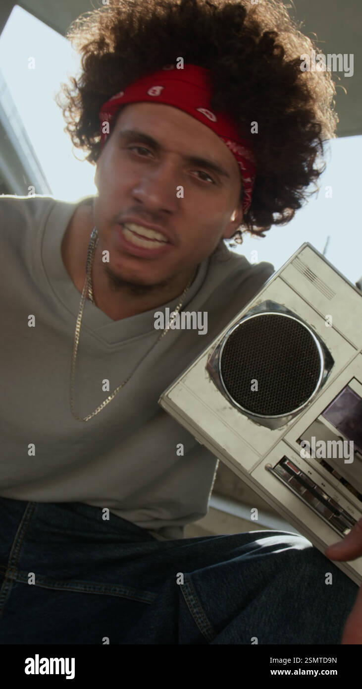 Expressive Hip Hop Musician Holding Boombox and Rapping on Camera Stock ...