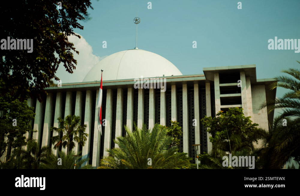 Timelapse of the flag of Indonesia in front of government building in ...