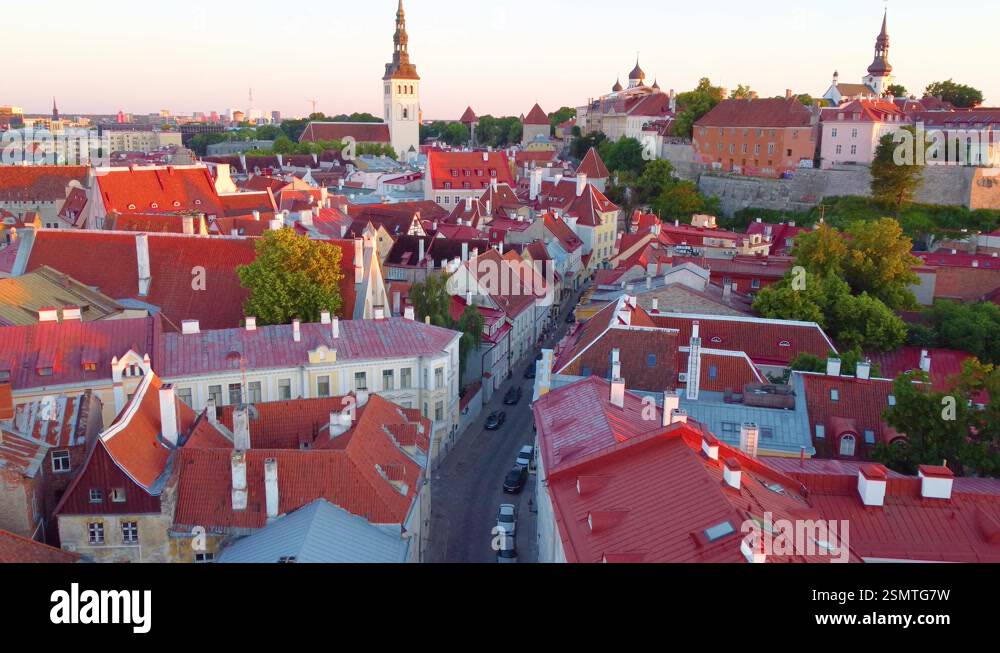 Golden hour small street, rooftops and church steeples in Tallinn ...