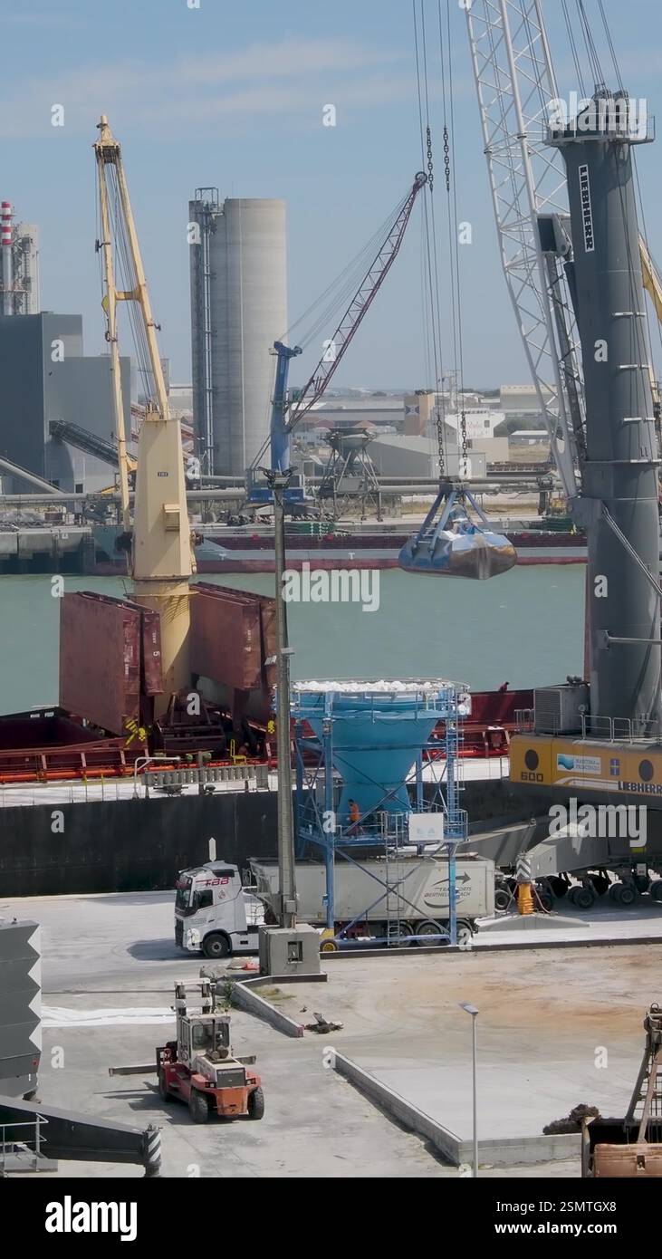 A Crane Unloading Aggregate into a Funnel and into a Lorry Stock Video ...