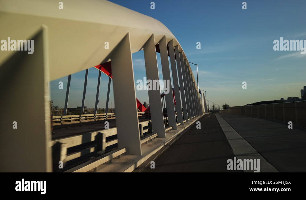 Cycling on a bike path next to the curved design of Commissioners ...