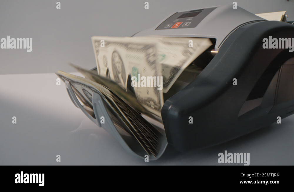 Closeup currency counting machine flipping dollar banknotes. Money ...