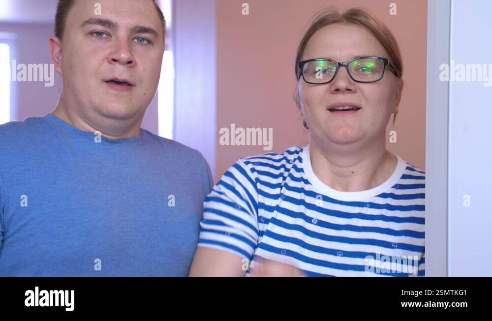 A Candid Portrait Featuring a Couple in a Cozy Domestic Setting ...