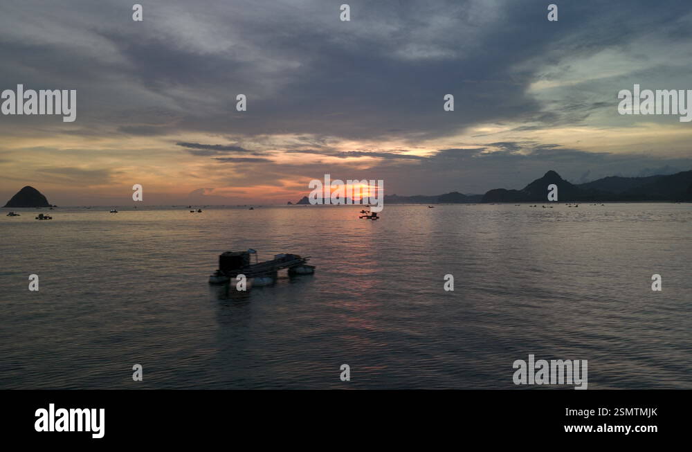 Drone flight over ocean with Outrigger boats on sea Kenawa Island Stock ...