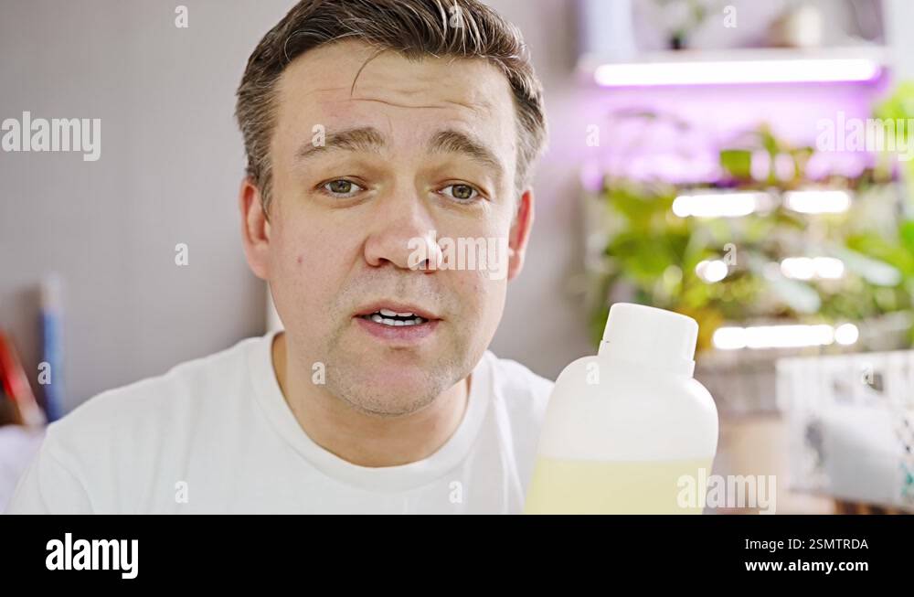 A middle-aged man tells and shows scents for candles and cosmetics ...
