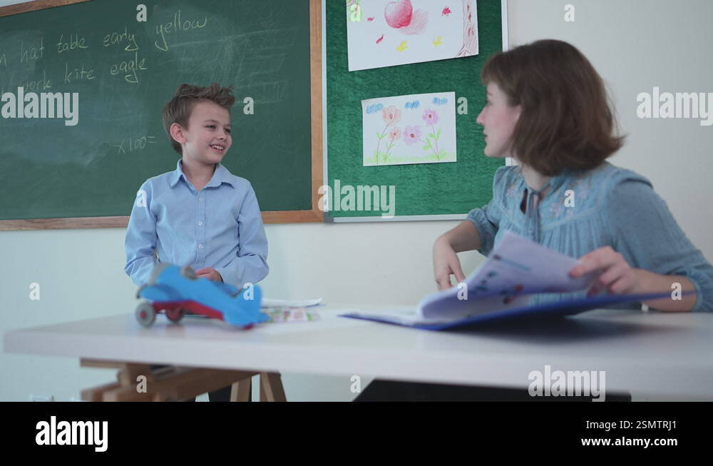 Children with classroom presentation activities in front of the ...