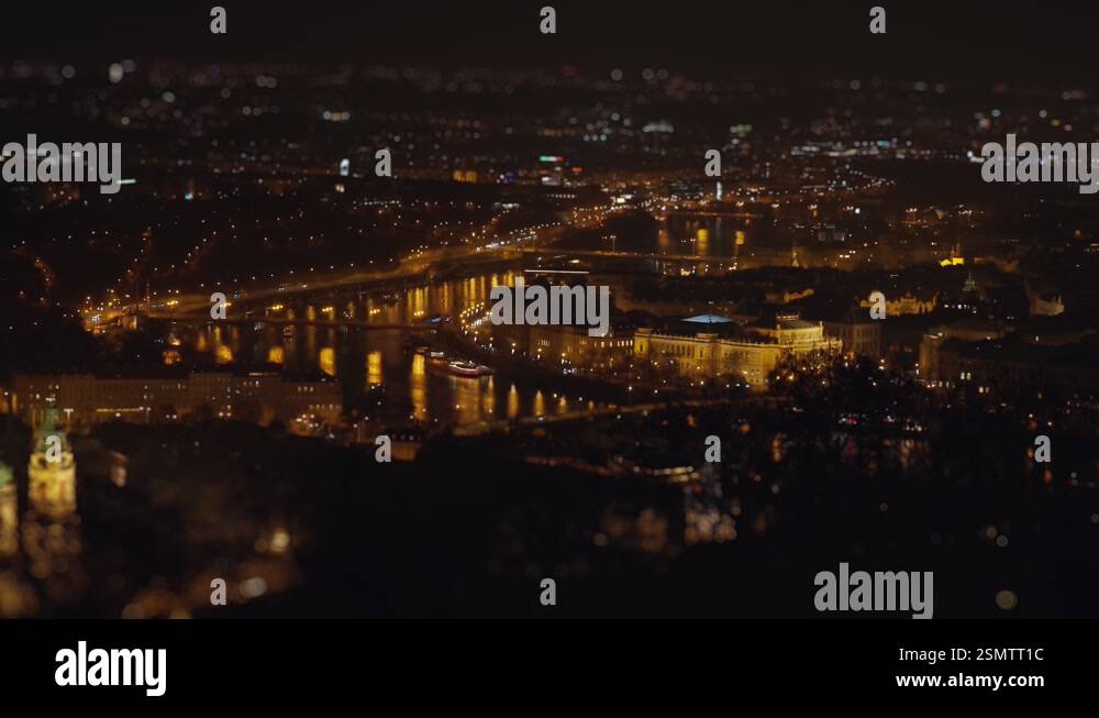 Prague downtown at night. Dim street lights illuminate the scene and ...