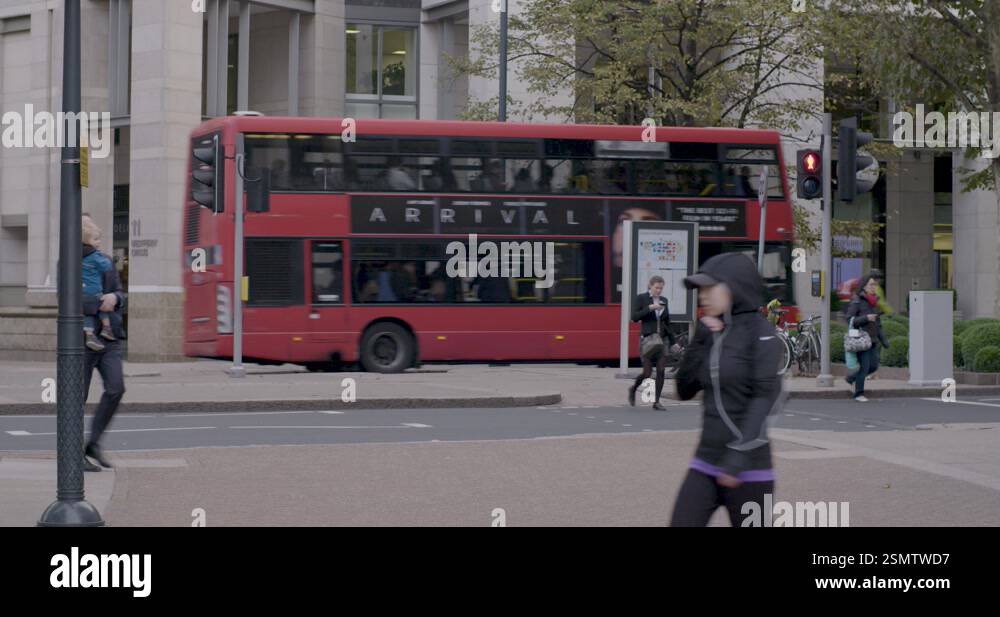 London, United Kingdom (UK) - 07/15/2024: People wait at a crosswalk in ...