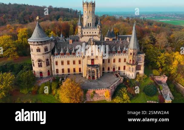 Aerial drone view of medieval castle Marienburg in forest on hill near ...