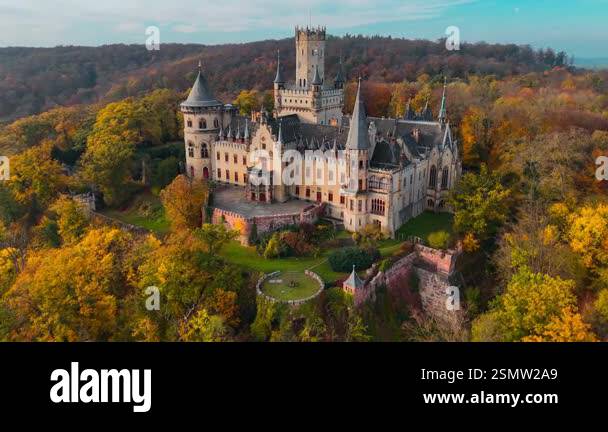 Aerial drone view of medieval castle Marienburg in forest on hill near ...