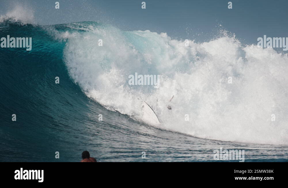 HURAA ISLAND, MALDIVES - JULY 20, 2024: Surfer falls during take off in ...