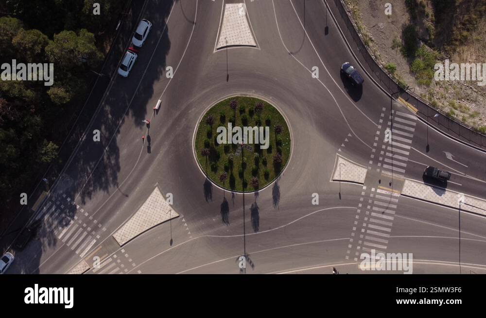 Triangular roundabout in Tbilisi with an aerial view as commuters drive ...