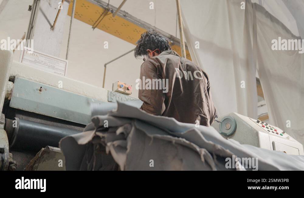 Lahore, Pakistan - 05/12/2024: Worker Processing Animal Hides In A ...
