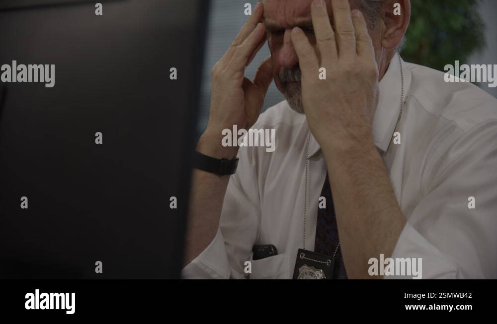 police officer close up reading evidence files Stock Video Footage - Alamy