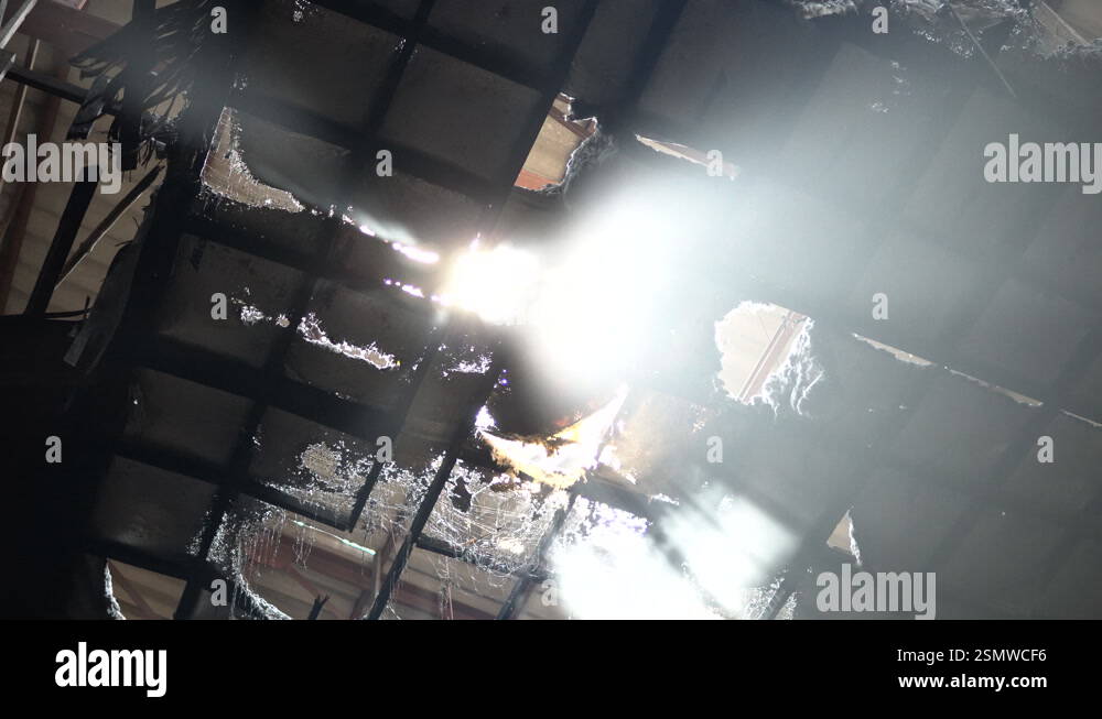 Demolished ruined ceiling abandon building light shine through dusty ...