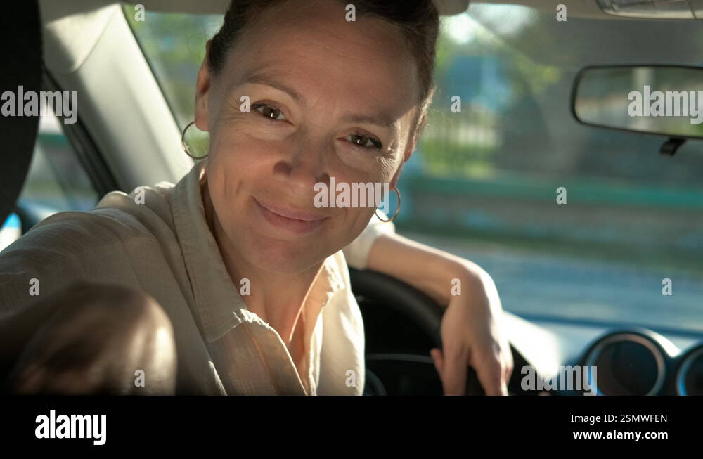 Driver behind wheel posing Stock Video Footage - Alamy