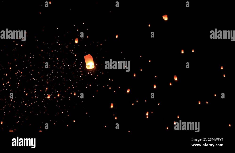Sky Lanterns Fly Into The Night Sky Stock Video Footage - Alamy