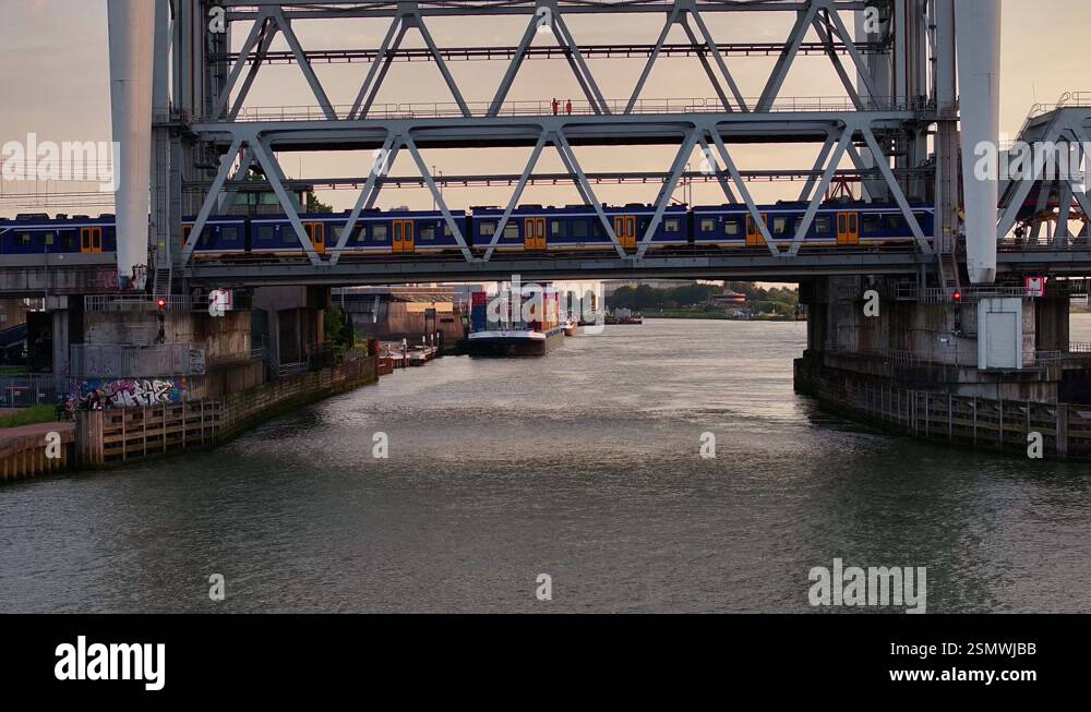 Dordrecht, Netherlands - 07/20/2024: Train crosses truss bridge over ...