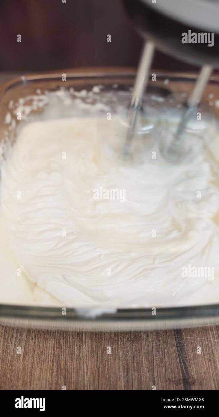Amul Mithai Mate Sweetened Condensed Milk melting in a glass bowl Stock ...
