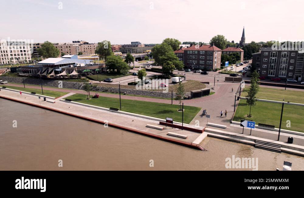 Sideways aerial pan showing the IJsselkade boulevard quay at river ...