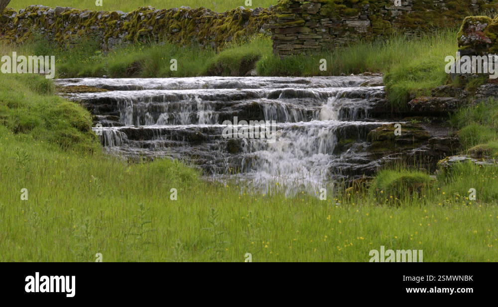 Wide shot of a waterfall on the upper river Wharfe by Cray, Buckden ...