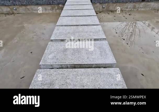 stone walkways over water ponds on metal struts levitate stone slabs ...