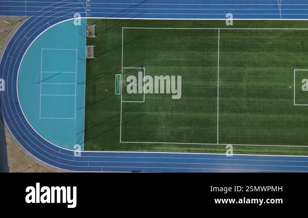 sports stadium with a running track with several lanes. inside oval ...