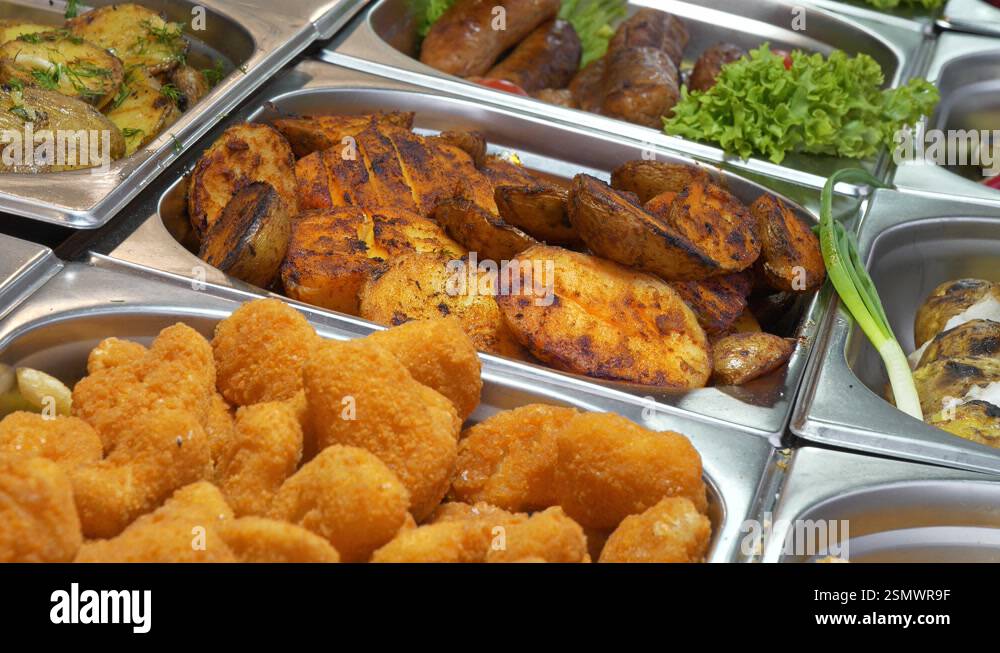 Various boiled, fried and deep-fried foods in fast food restaurant ...