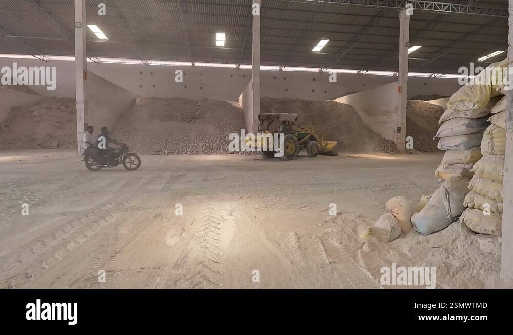 JCB taking soil inside the factory Stock Video Footage - Alamy