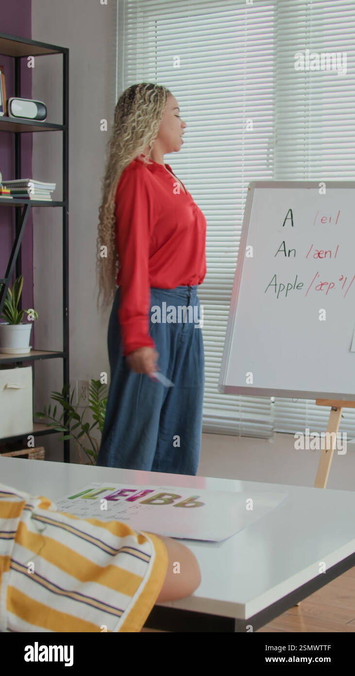 Female Tutor Explaining at Whiteboard during Speech Therapy Class Stock ...