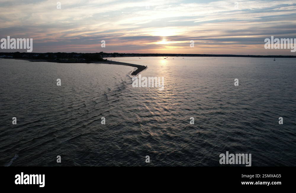 A sunset flight over the sandbar at incoming tide near Conimicut Point ...