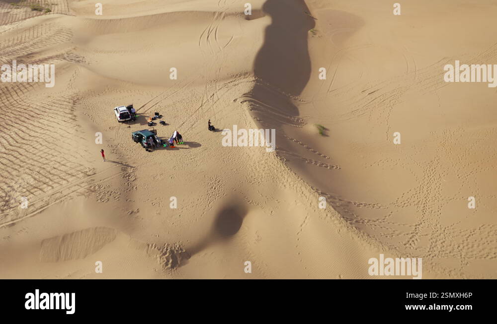 People camping in the Gobi Desert. Car trip in the desert. Off-road ...