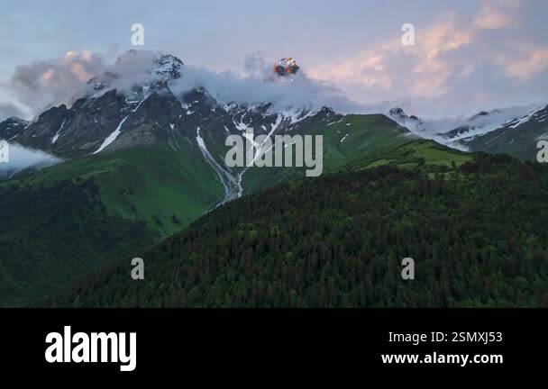 Aerial hyperlapse of Ushba peak at sunset in Caucasus mountains ...