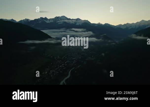 Aerial view of Svaneti mountains and Mestia valley at dawn. Snow-capped ...