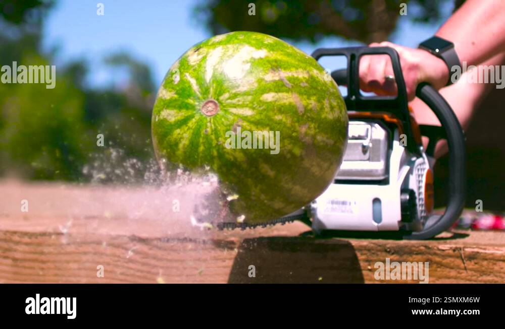 Tallinn, Estonia - 09/02/2024: Watermelon being cut in half by a ...