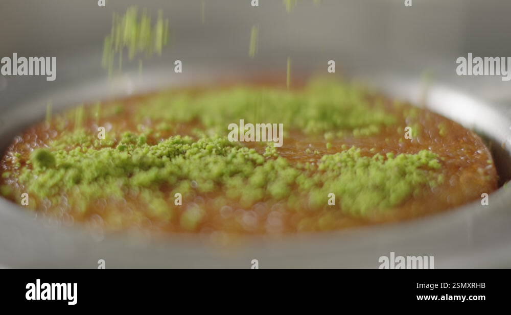 Traditional Turkish kunefe close-up. Chef sprinkle Stock Video Footage ...