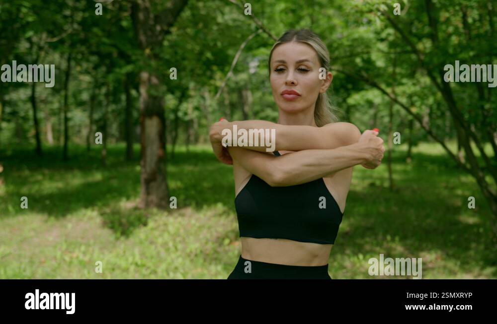 Athletic fit blond woman doing fitness exercises training full body ...