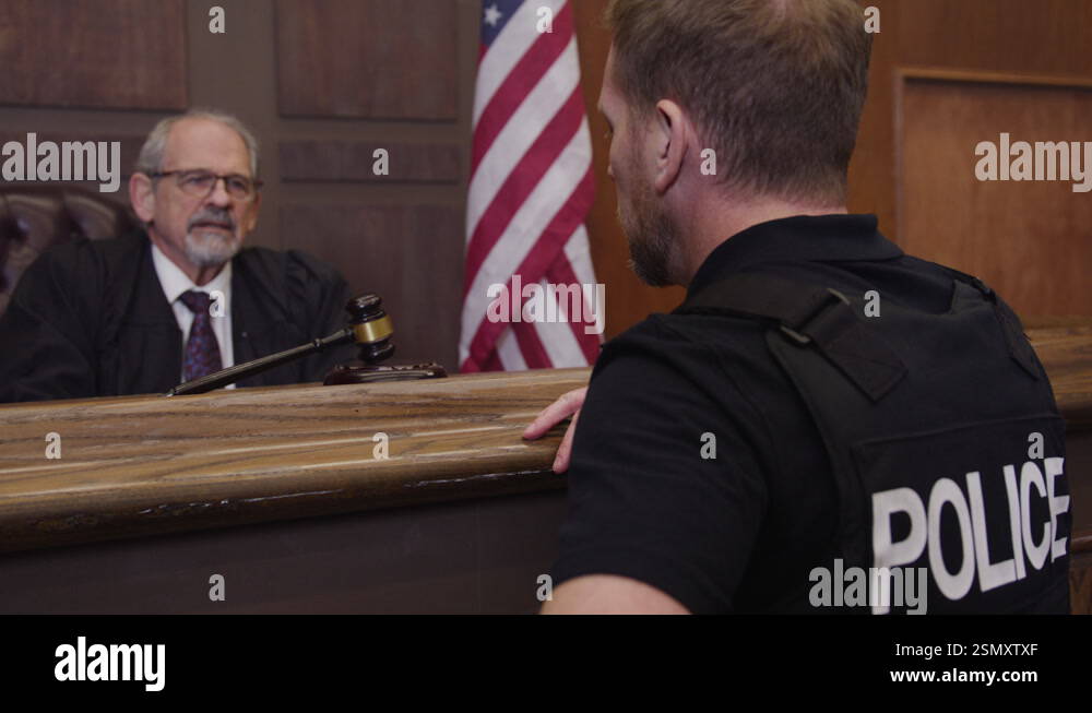 Zoom out from judge and cop in court room Stock Video Footage - Alamy