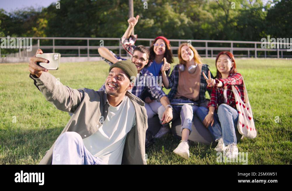 Five cheerful multiracial students friends smiling and rejoicing as ...
