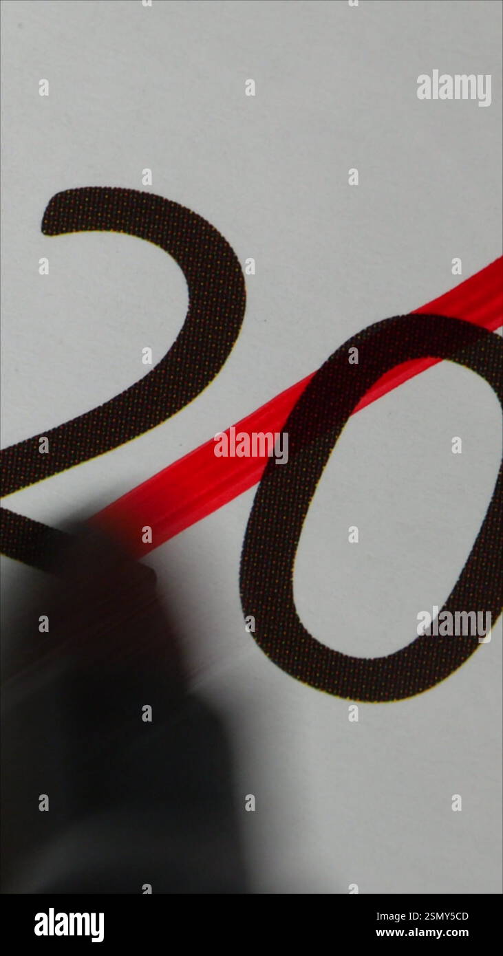 20 - Marking the date in the calendar with a red marker. The twentieth ...