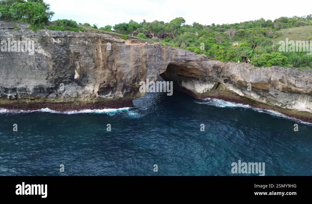 Aerial shot of Broken Beach with cliffs and the sea below Stock Video ...